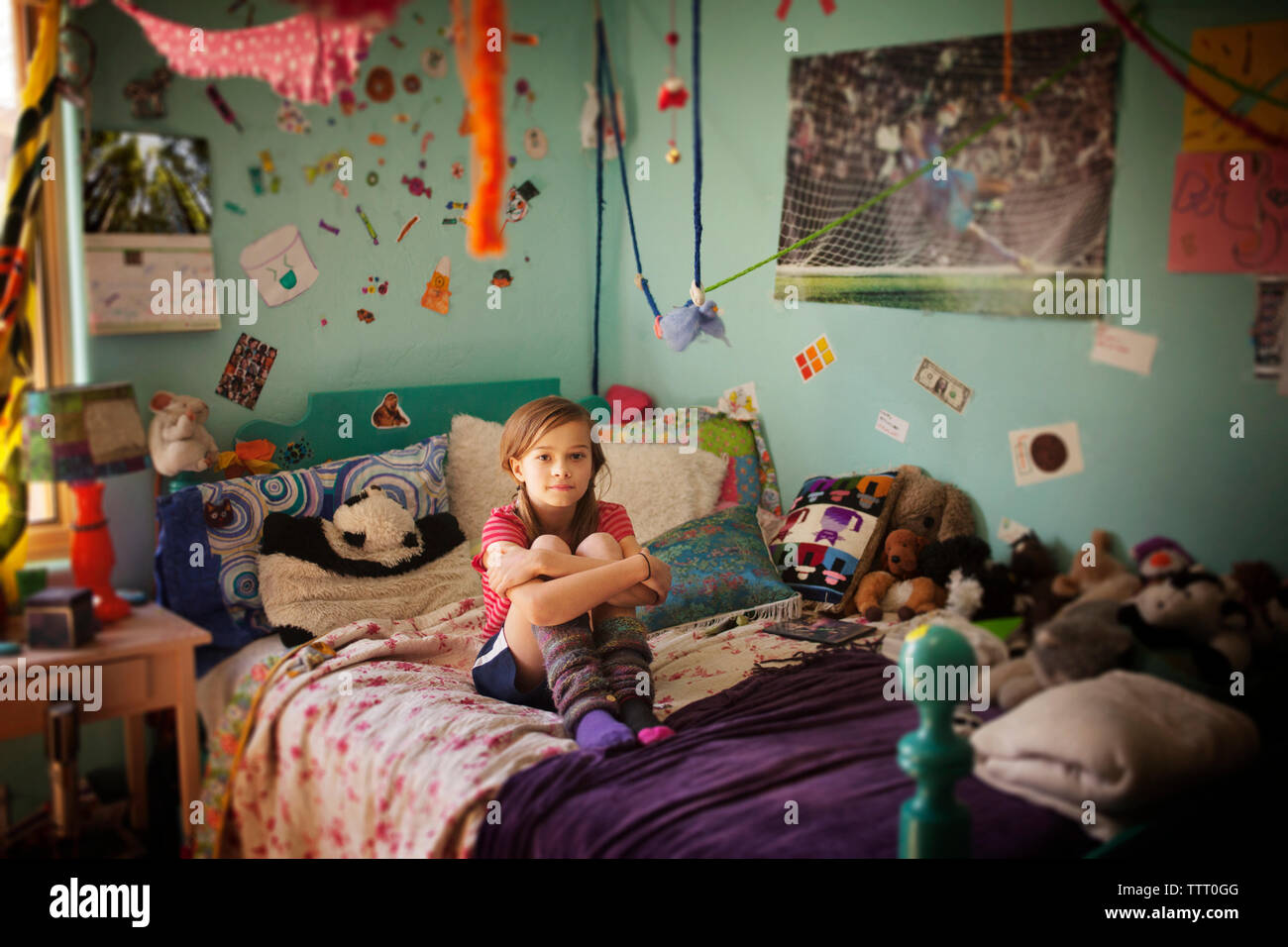 Portrait caucasian girl hugging knees hi-res stock photography and ...