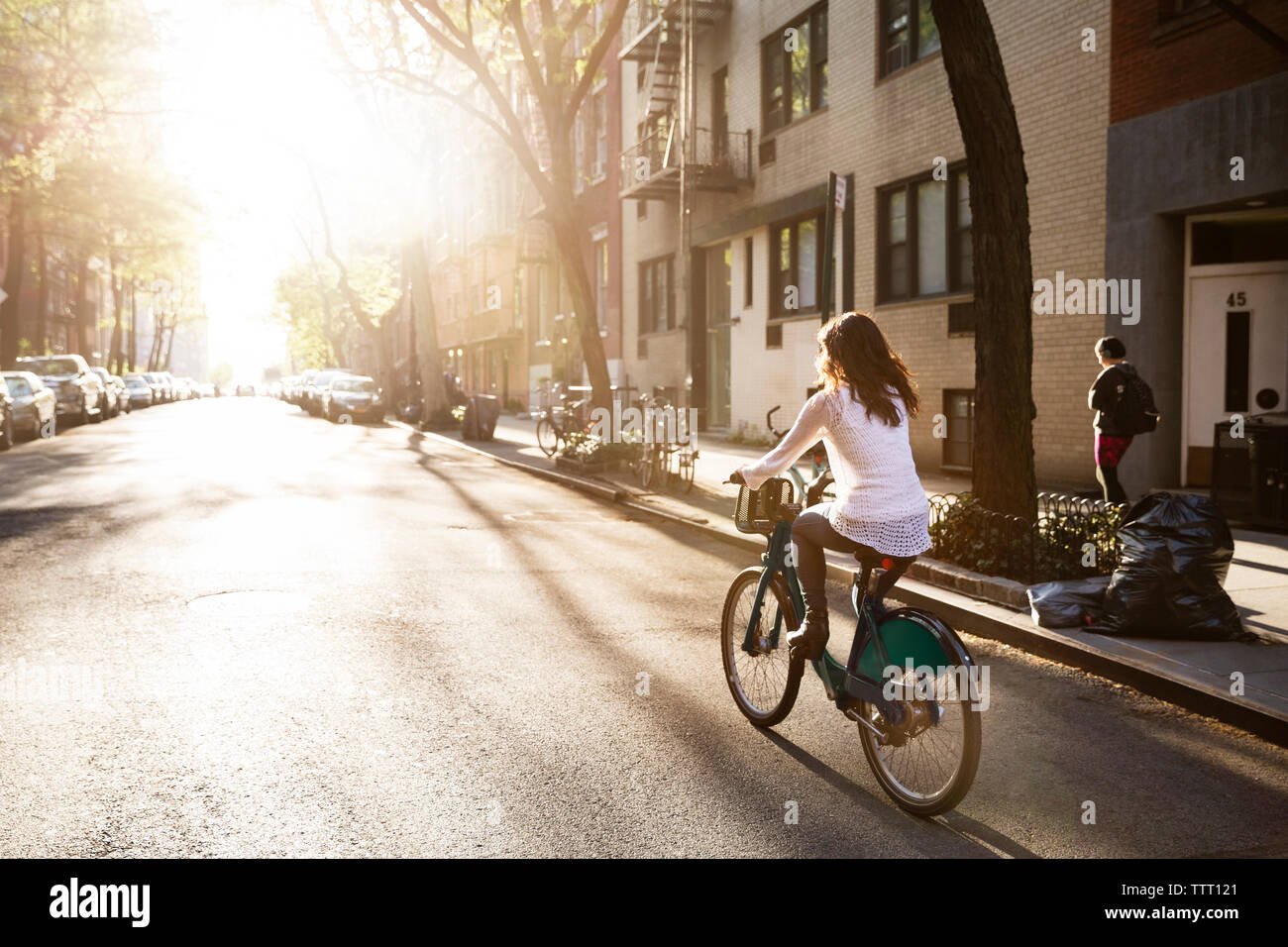 Woman bike rear view hi-res stock photography and images - Alamy