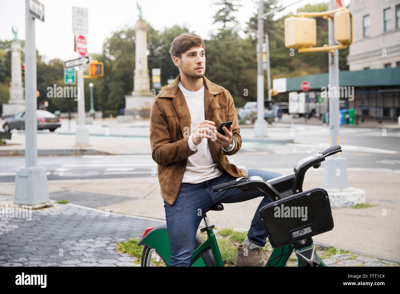 Man sitting on bicycle hi-res stock photography and images - Alamy