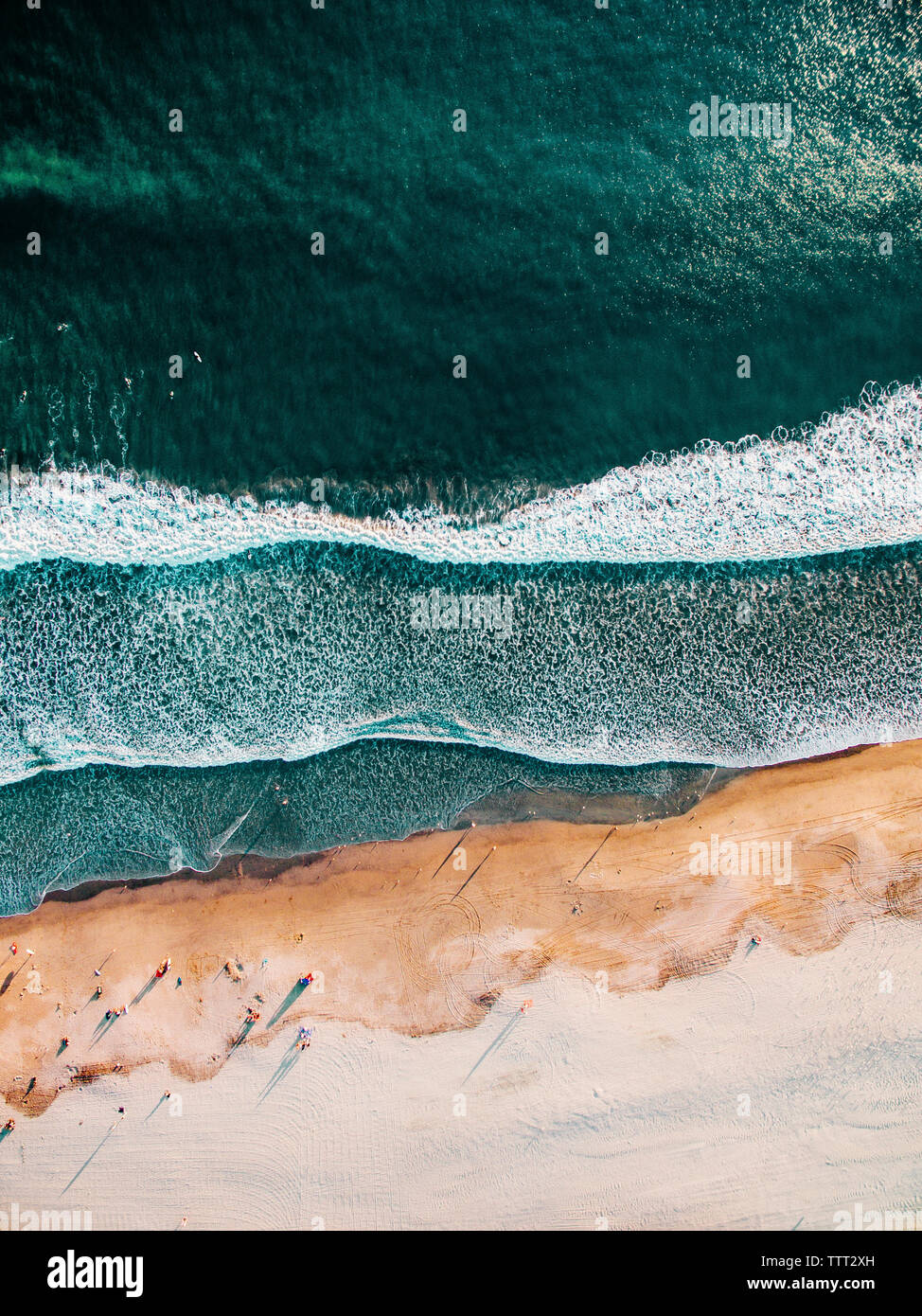 Overhead view of people on sea shore at Seal Beach Stock Photo - Alamy