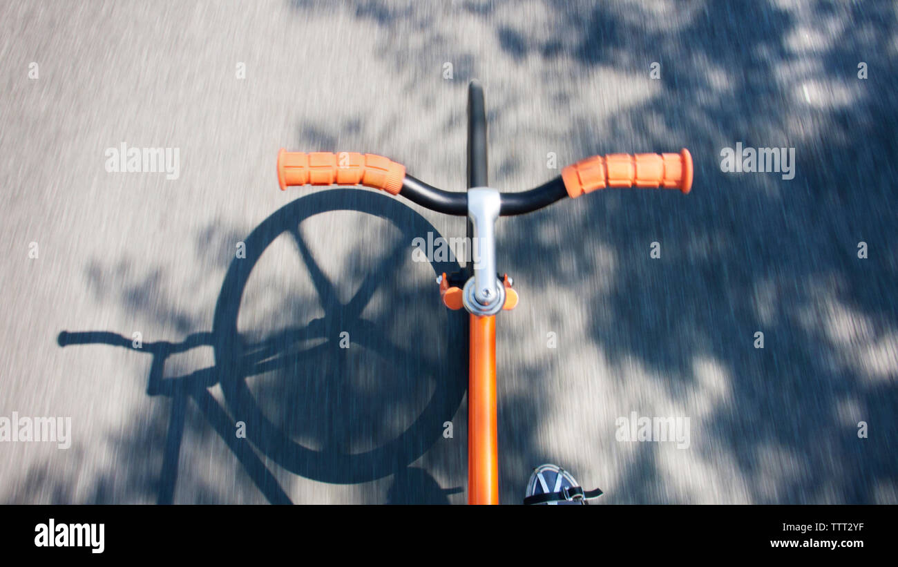 Overhead view of bicycle riding on street Stock Photo - Alamy