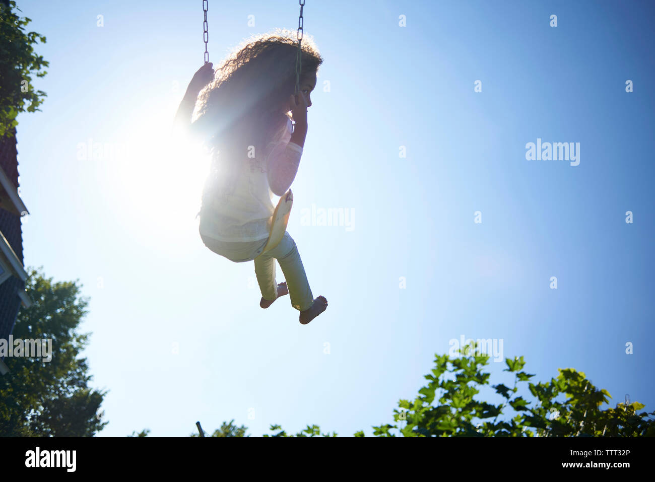 Low angle back view curly hi-res stock photography and images - Alamy