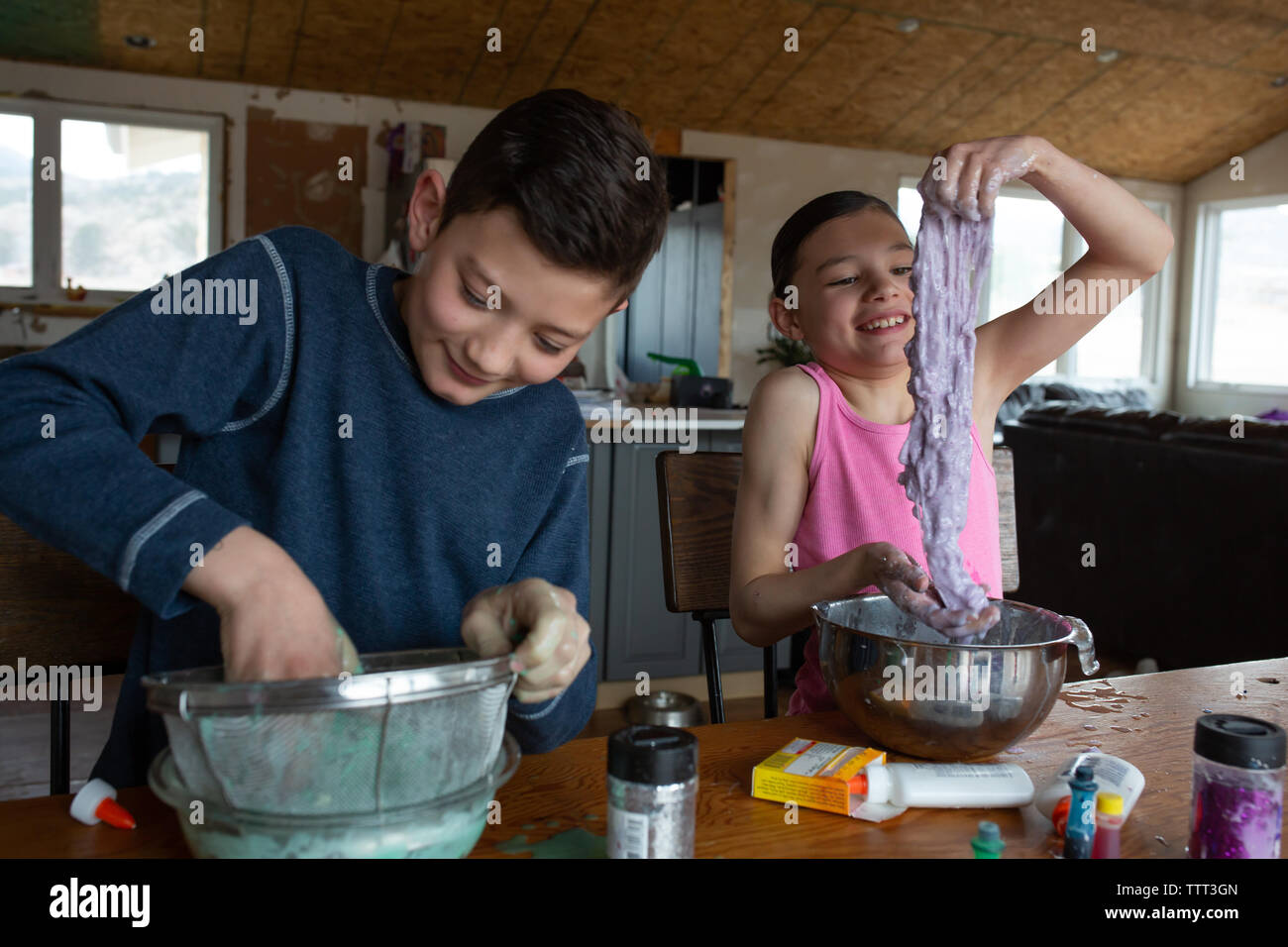 Kids playing with homemade slime they made Stock Photo - Alamy