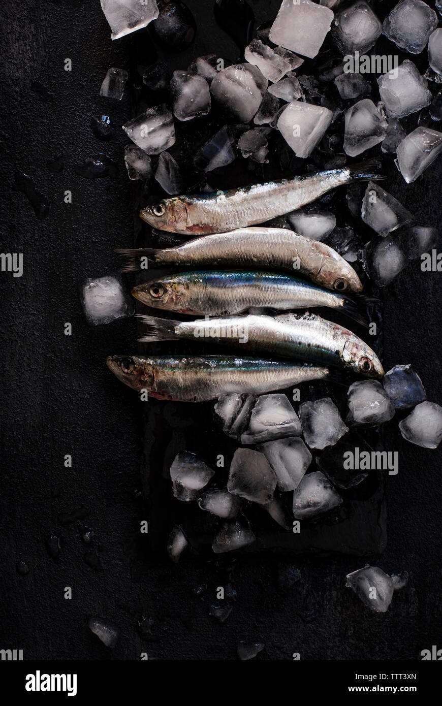 Ice cubes on black hi-res stock photography and images - Alamy