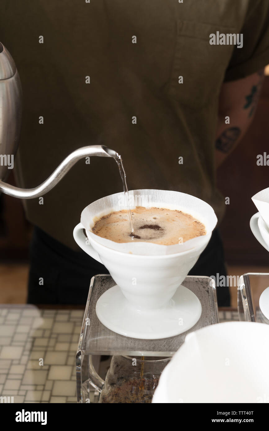 Person making coffee hi-res stock photography and images - Alamy