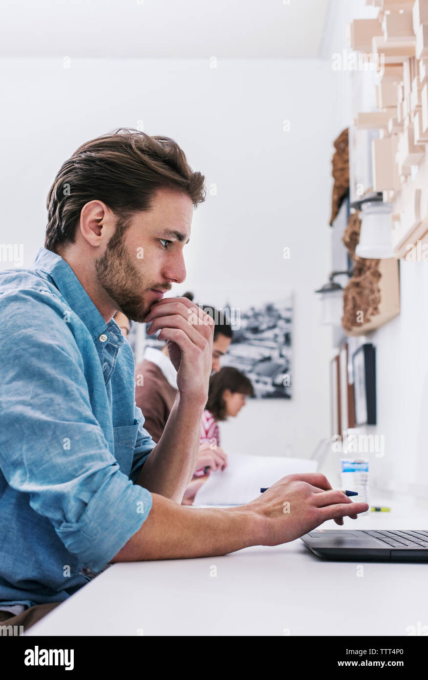 People sitting computers working office hi-res stock photography and ...