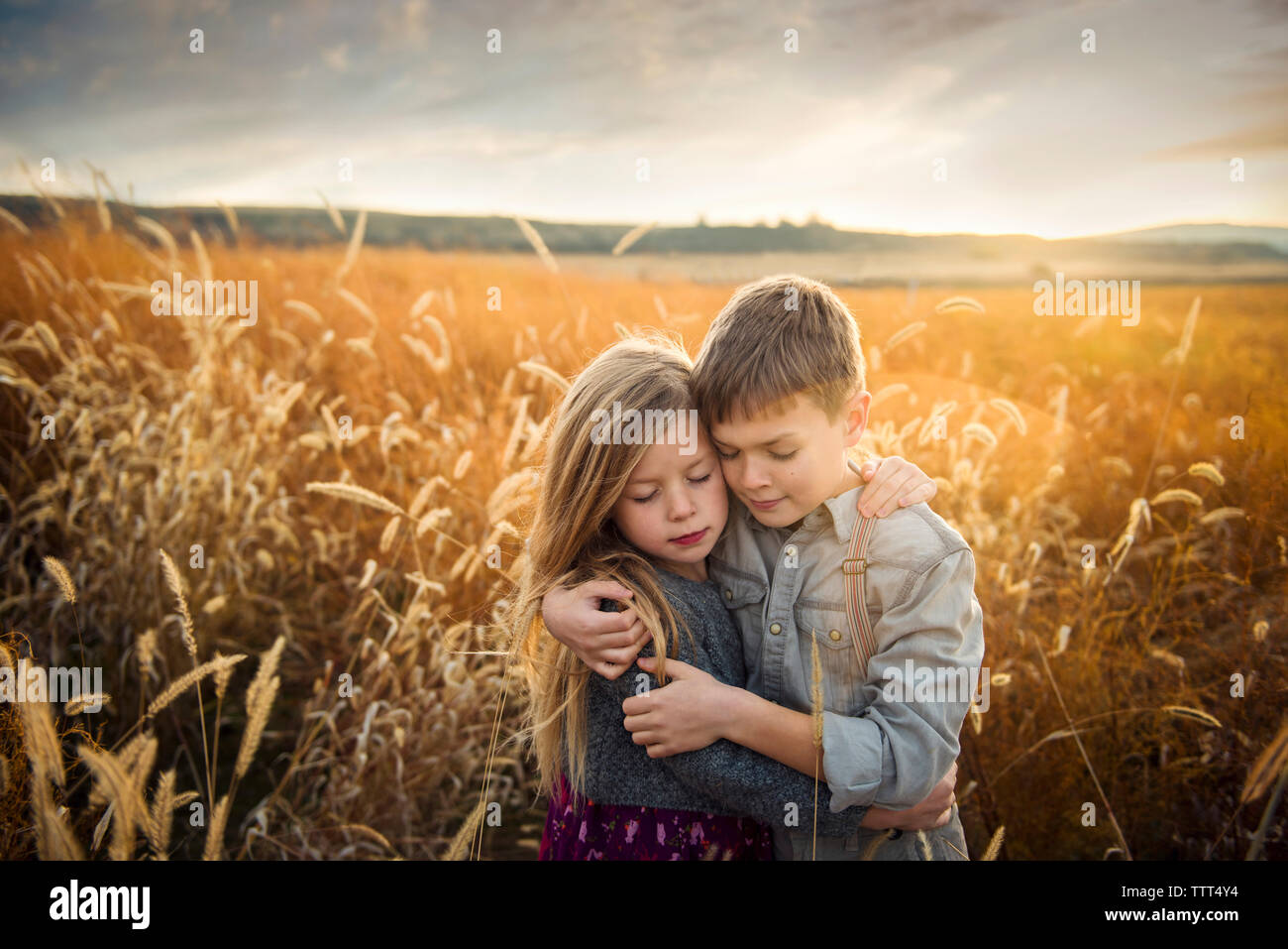 Cute siblings arms around hi-res stock photography and images - Alamy