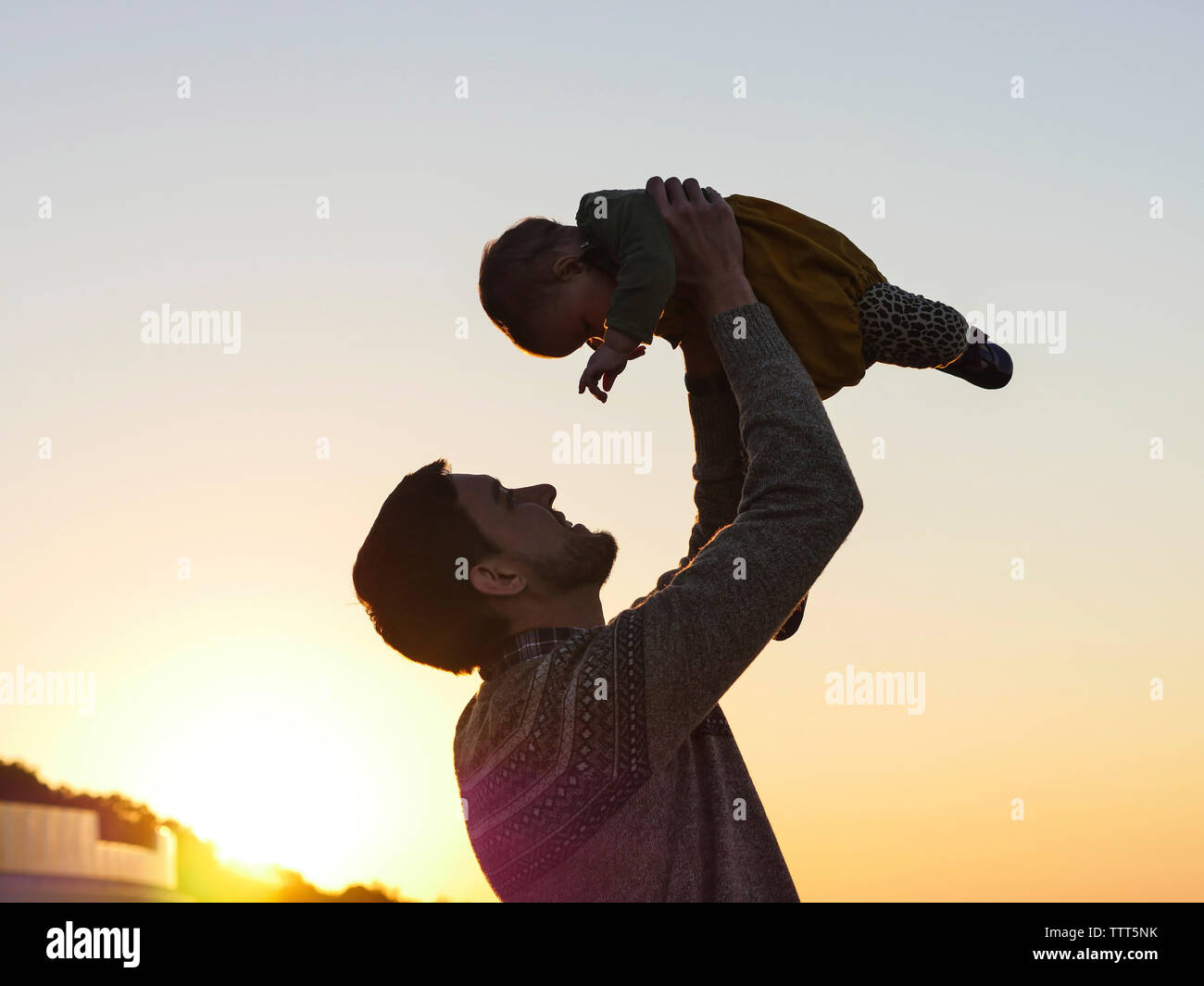 Father picking up his daughter hi-res stock photography and images - Alamy