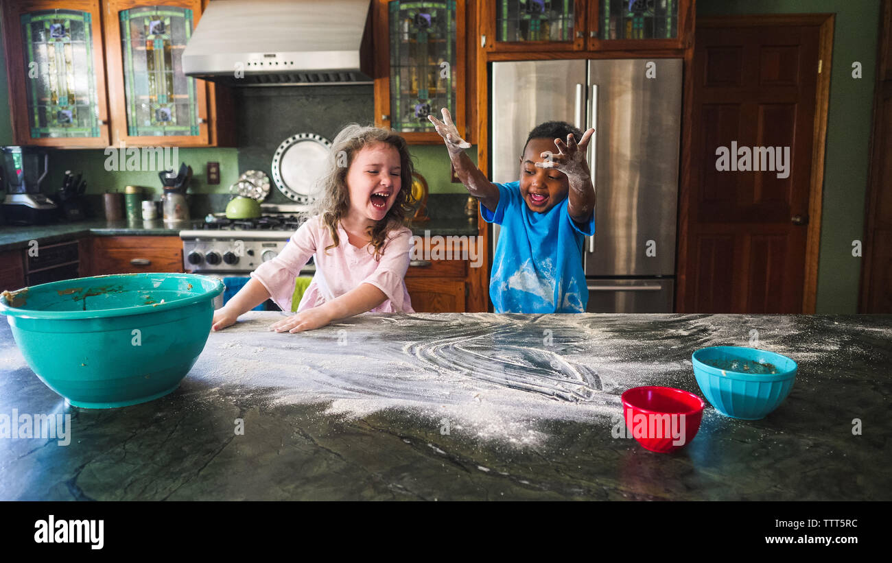 Boy mixing chocolate in kitchen hi-res stock photography and images - Alamy