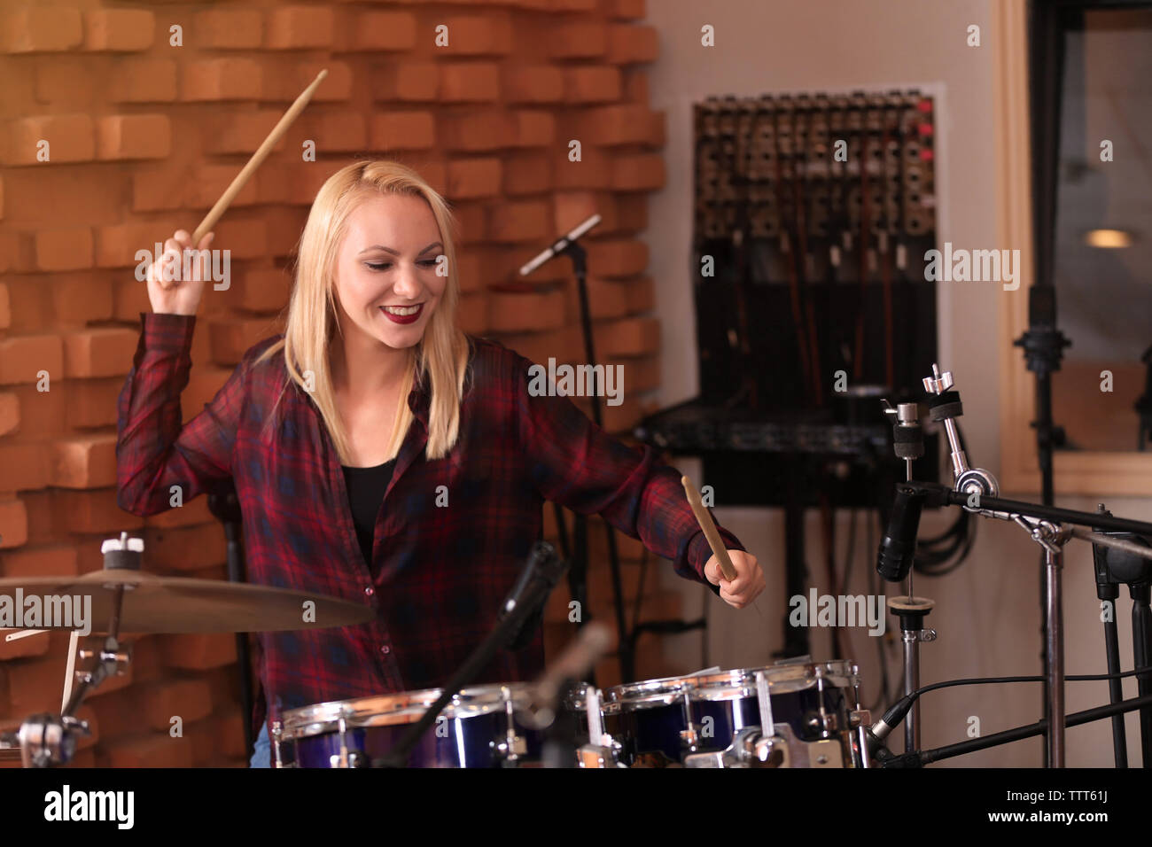 Woman playing the drums hi-res stock photography and images - Alamy