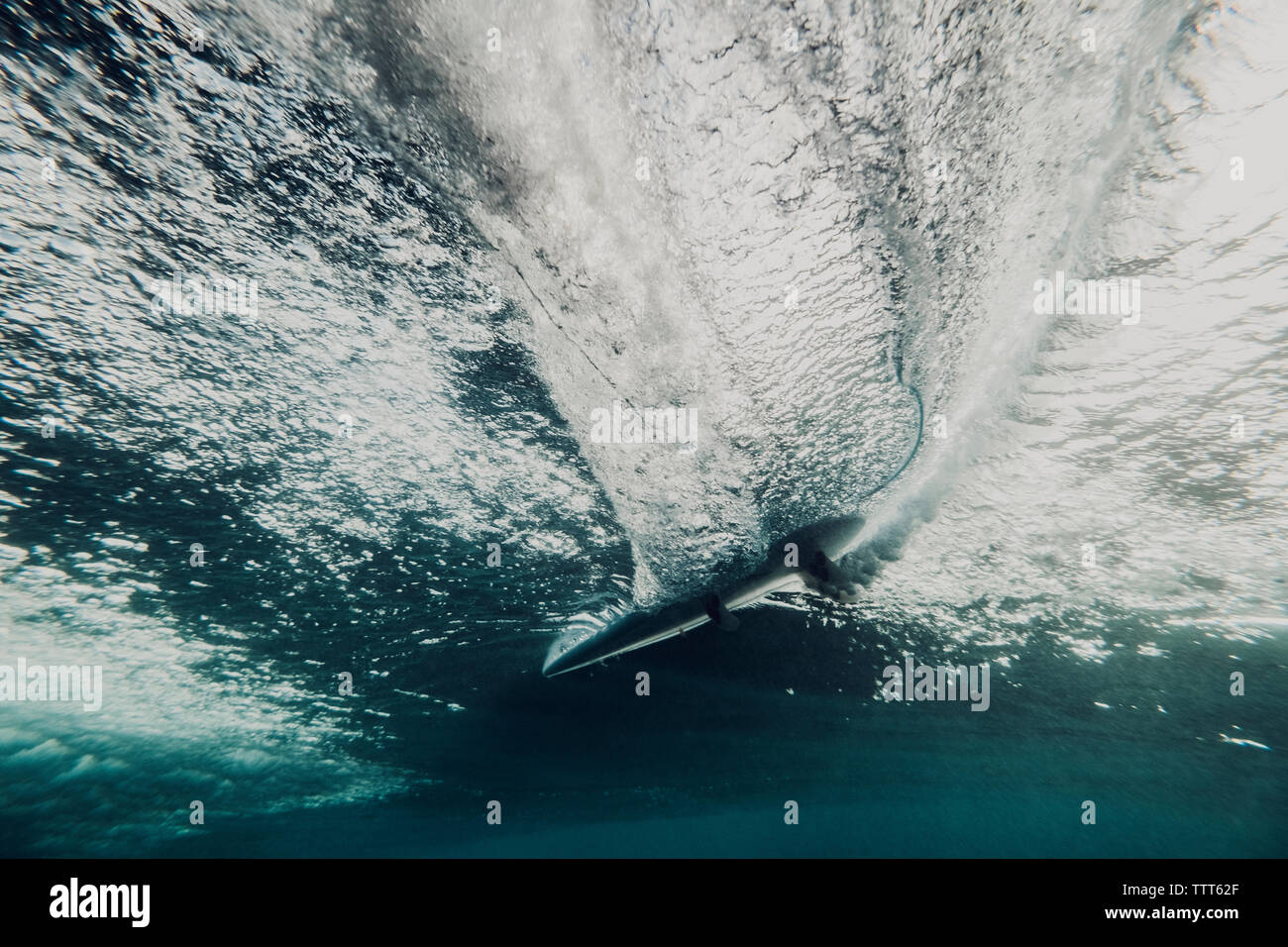 Underwater close-up of a surfboard in action Stock Photo - Alamy