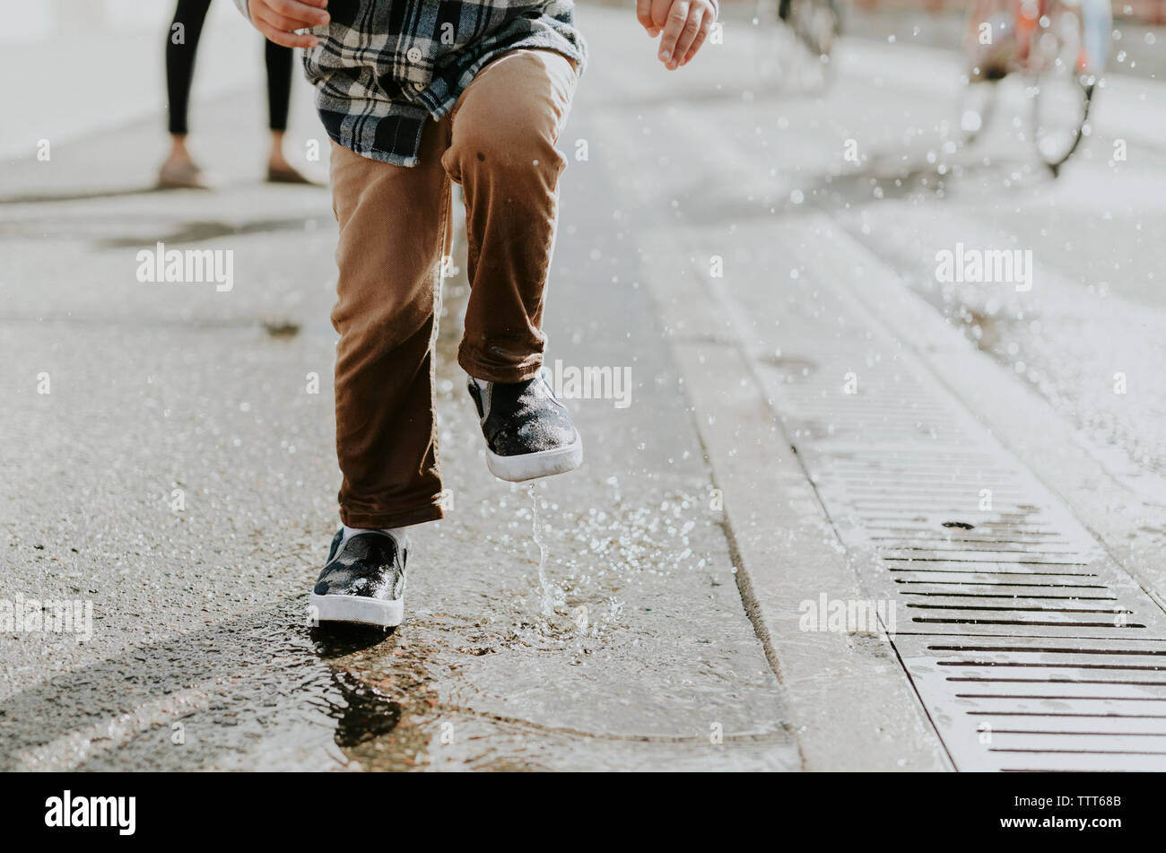 Puddle of water on the street hi-res stock photography and images - Alamy