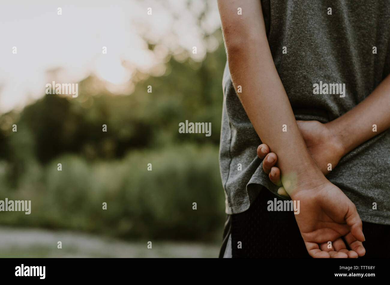 Hands behind back hi-res stock photography and images - Alamy
