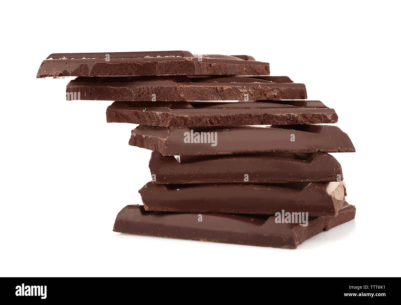 Pile of dark chocolate tiles isolated on white Stock Photo - Alamy