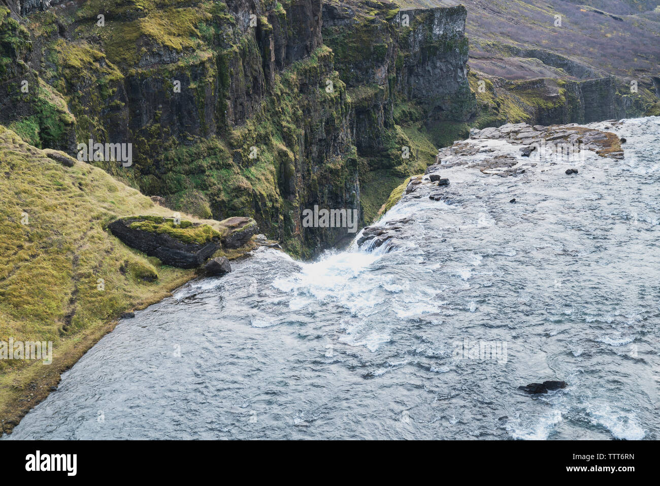 High angle view of stream flowing through rock formations Stock Photo ...