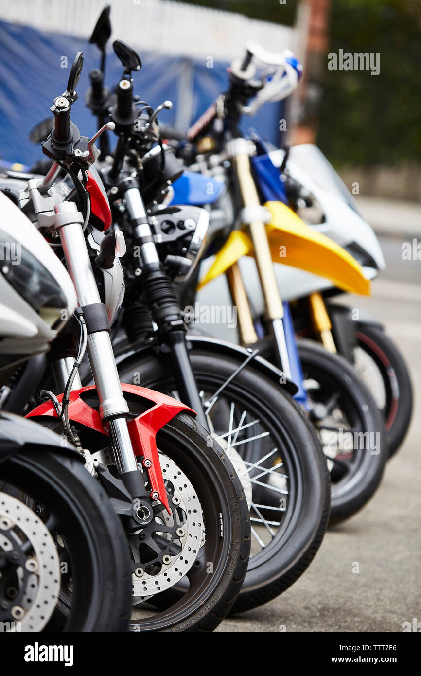Motorcycles parked on street Stock Photo - Alamy