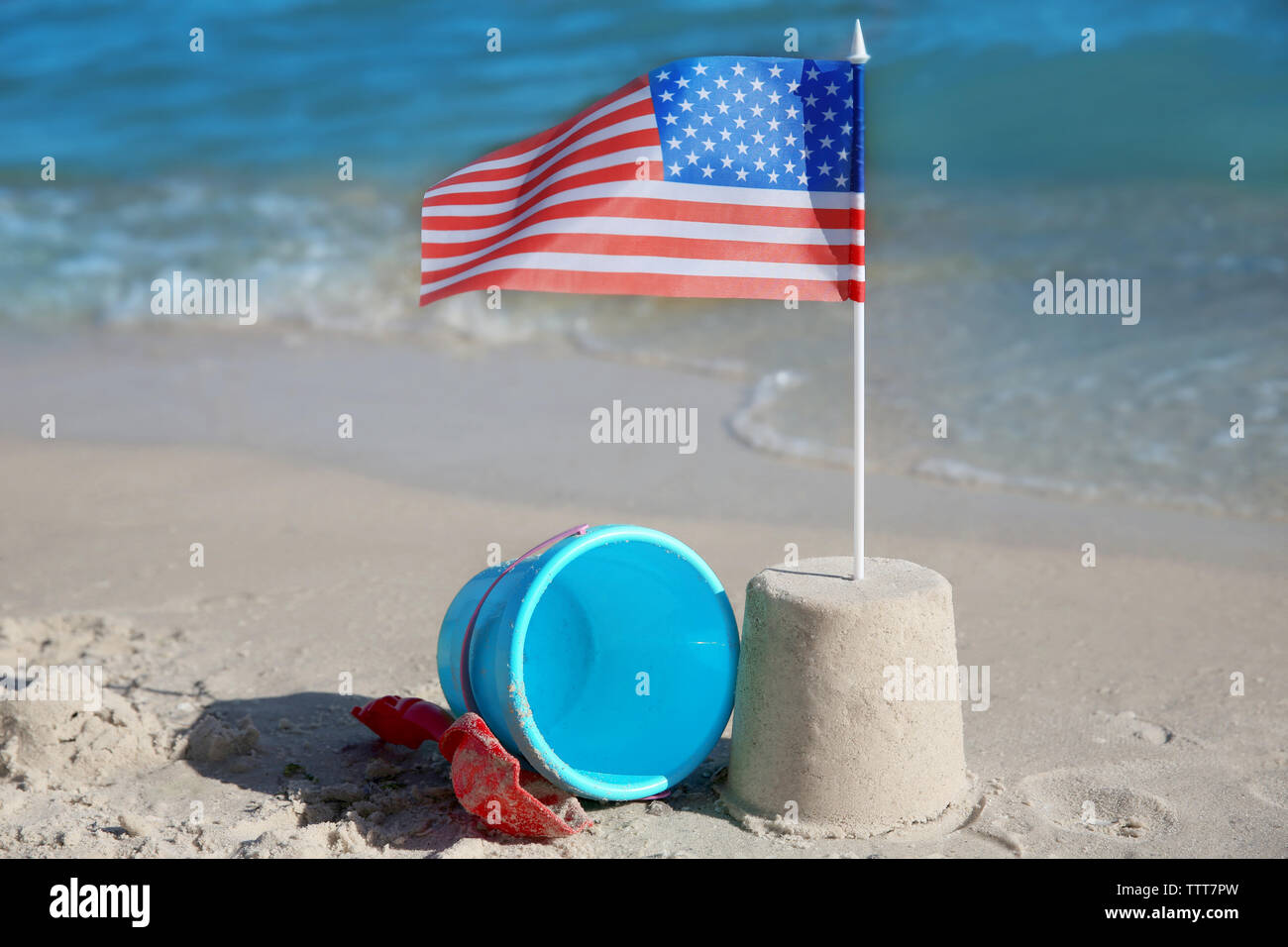 Sand castle with American flag on beach Stock Photo - Alamy