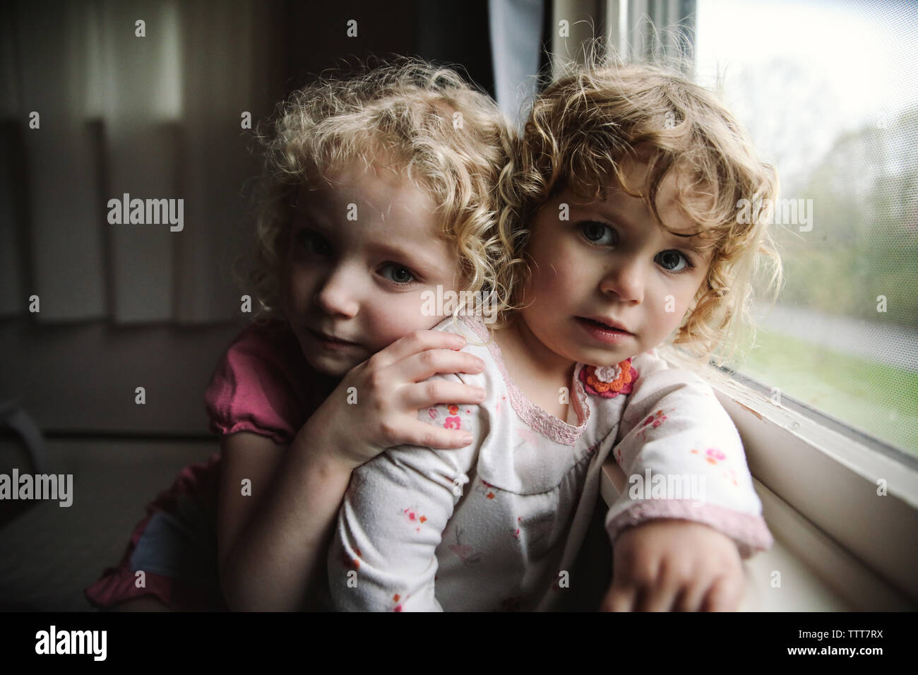Sisters on window sill hi-res stock photography and images - Alamy