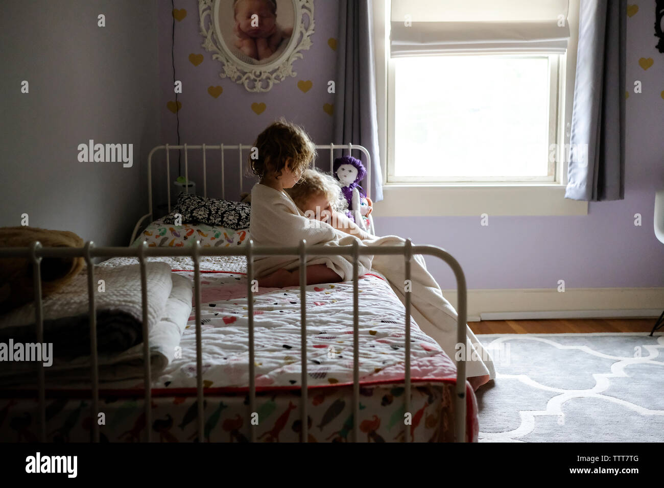Leaning on bed hi-res stock photography and images - Alamy