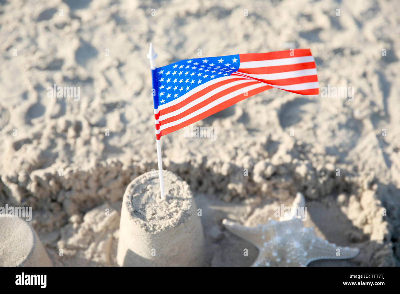 Sand castle with American flag on beach Stock Photo - Alamy