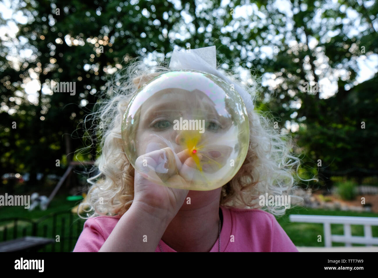 Girl blowing up balloon hi-res stock photography and images - Alamy