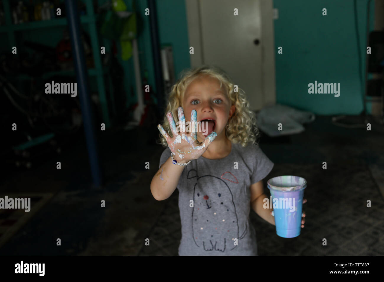 young girl showing off messy hand after creating art Stock Photo - Alamy