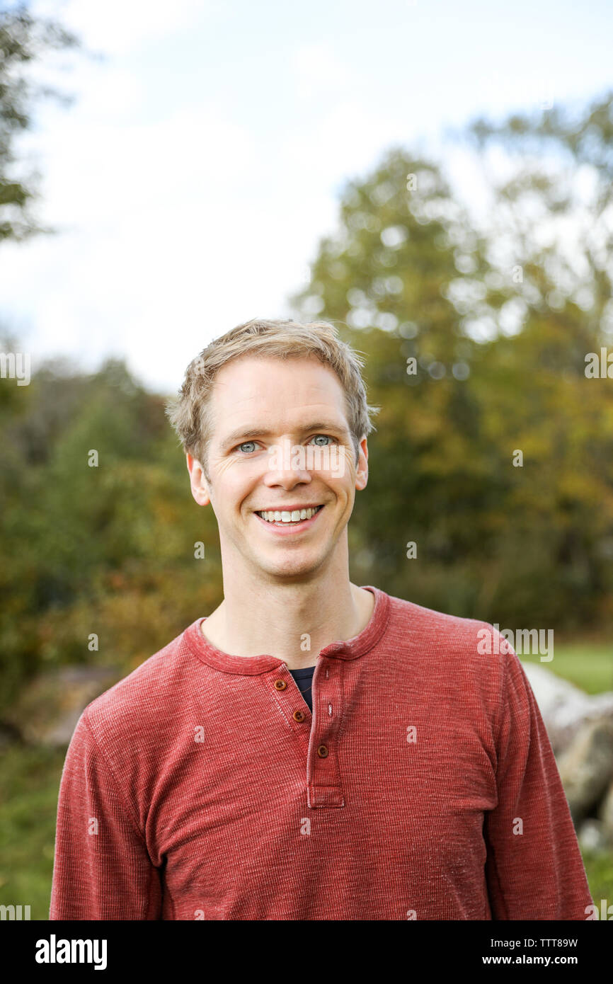 Smiling grown male standing hi-res stock photography and images - Alamy