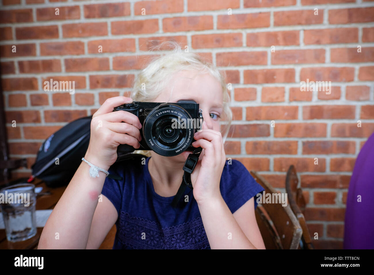 Girl take picture of photographer with camera outdoors Stock Photo - Alamy
