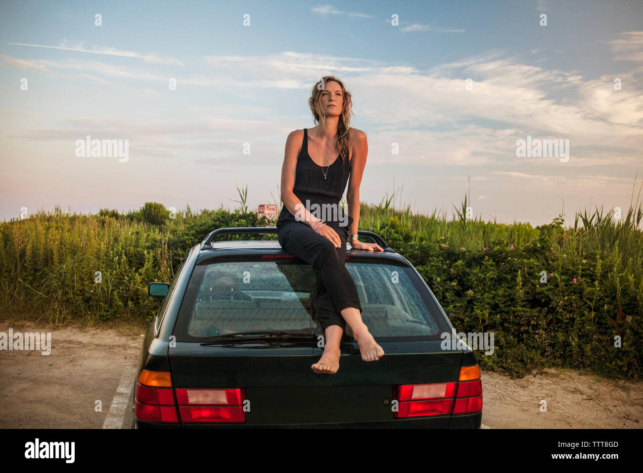 Woman on roof of car hi-res stock photography and images - Alamy