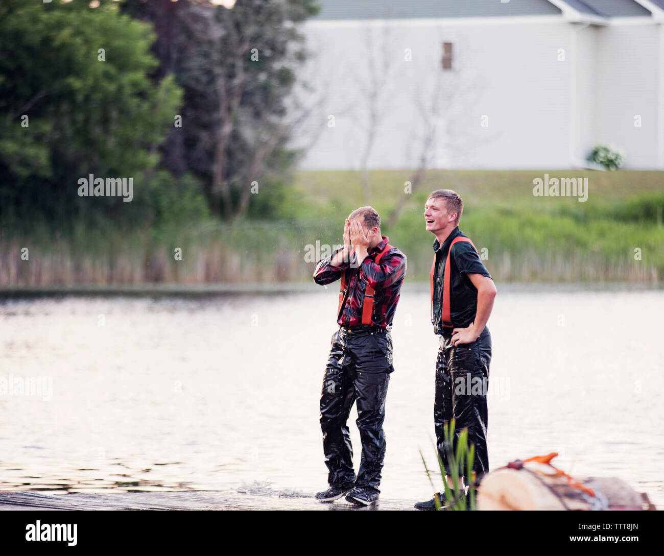 Wet people standing at riverbank Stock Photo - Alamy