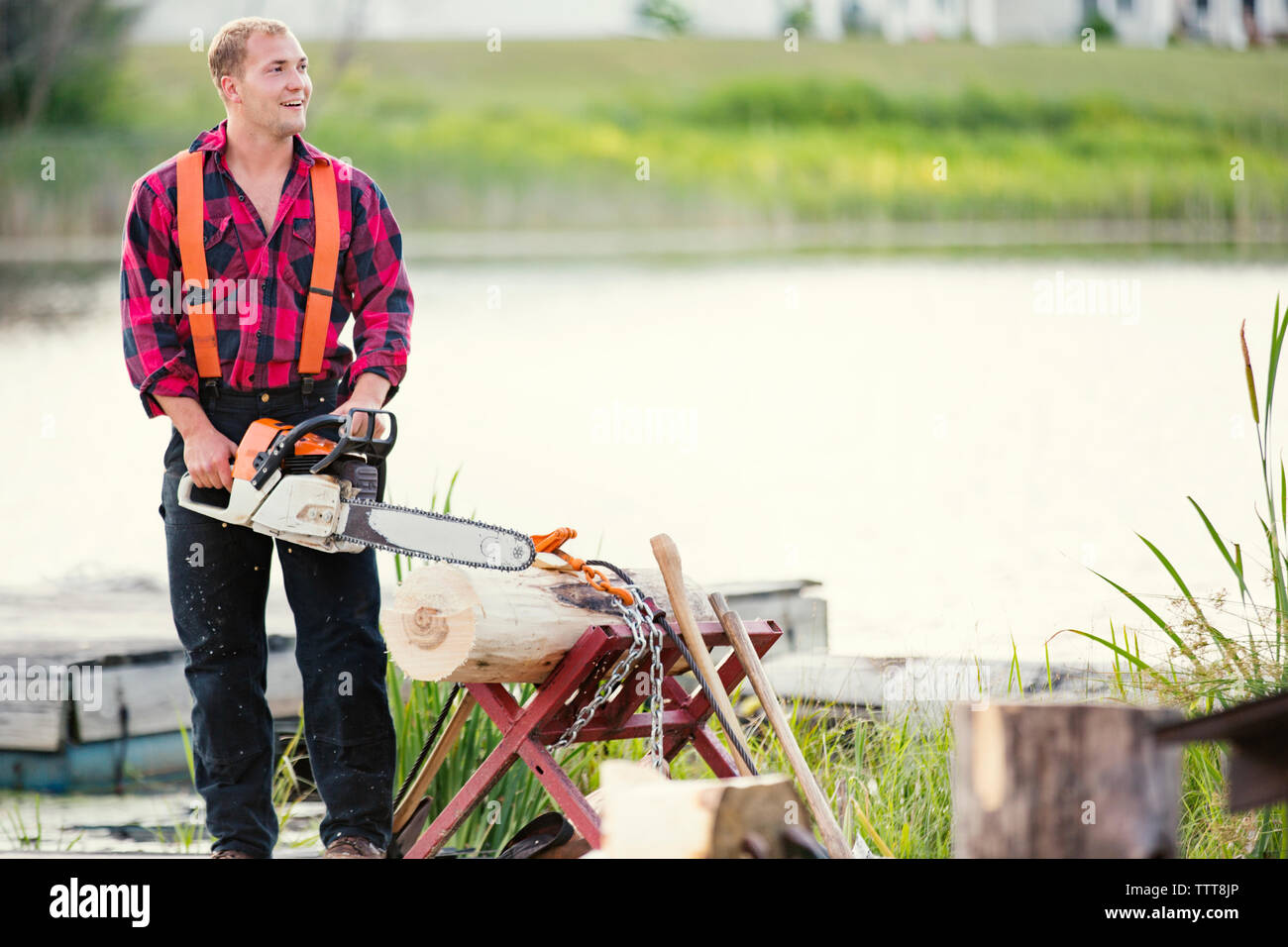 Old man cutting log hi-res stock photography and images - Alamy
