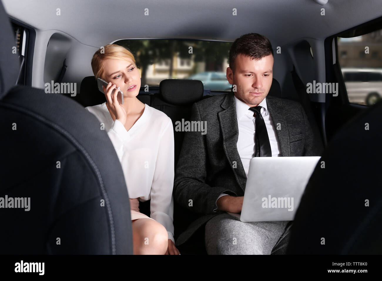 Businesspersons going to work by car Stock Photo - Alamy