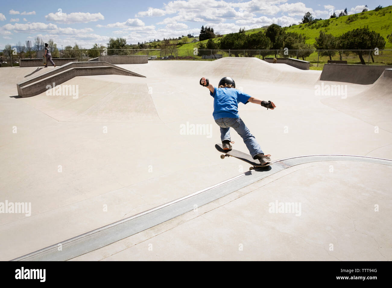 High angle view of boy performing stunt on skateboard ramp Stock Photo ...