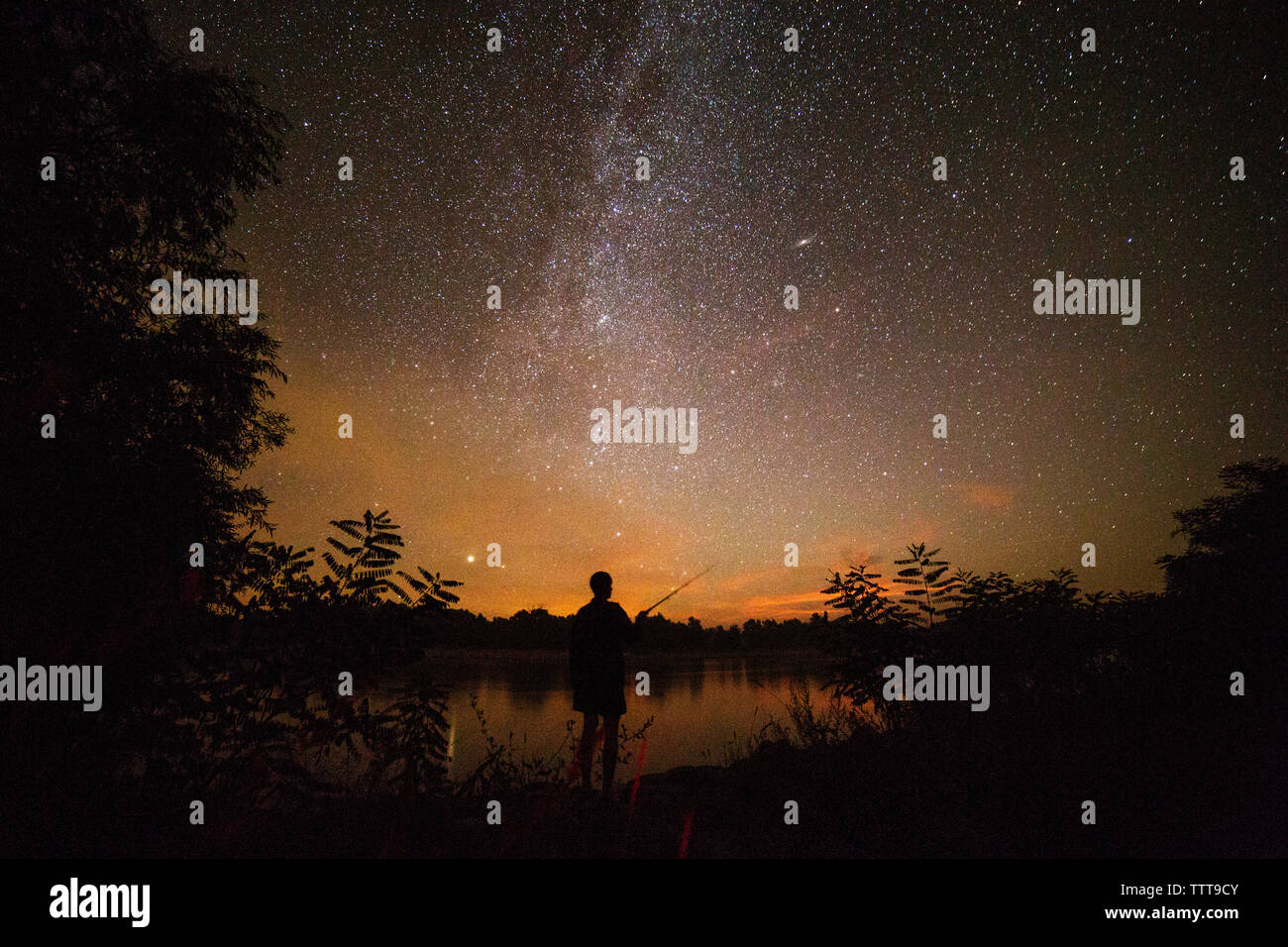 Man standing against starry sky hi-res stock photography and images - Alamy