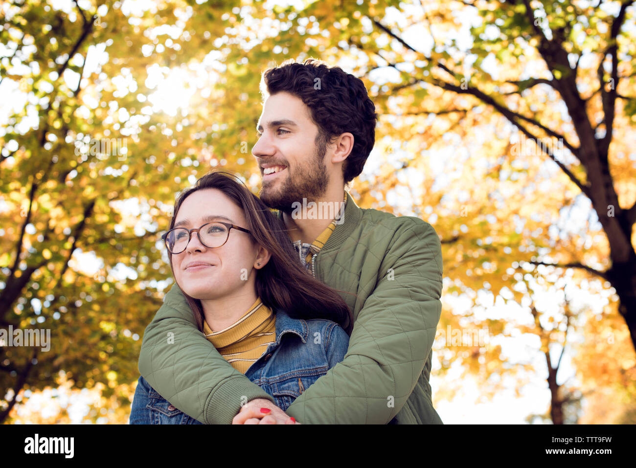 Young couple embracing during hi-res stock photography and images - Alamy