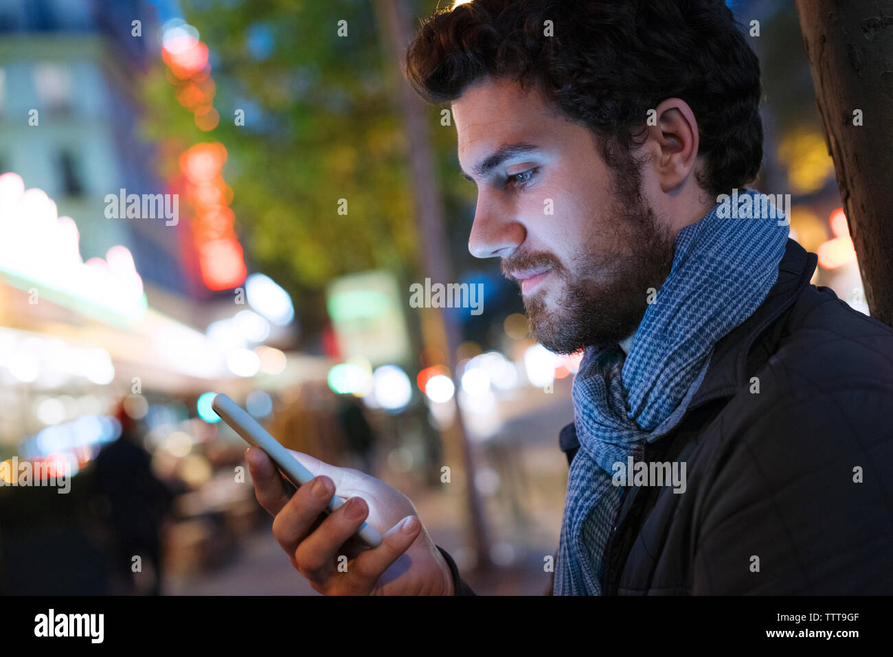 Side view handsome man using hi-res stock photography and images - Alamy