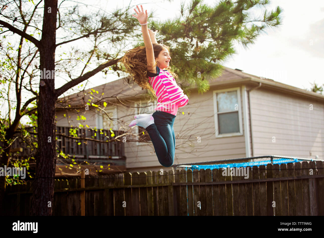 Girl raised arms hi-res stock photography and images - Alamy
