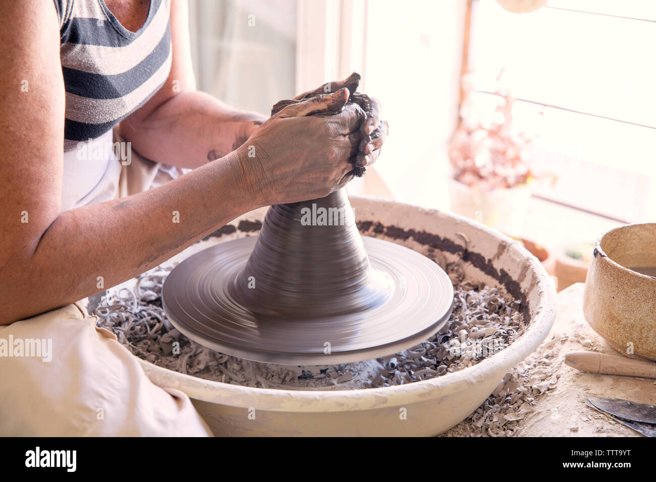 Pottery making spinning wheel clay hi-res stock photography and images ...