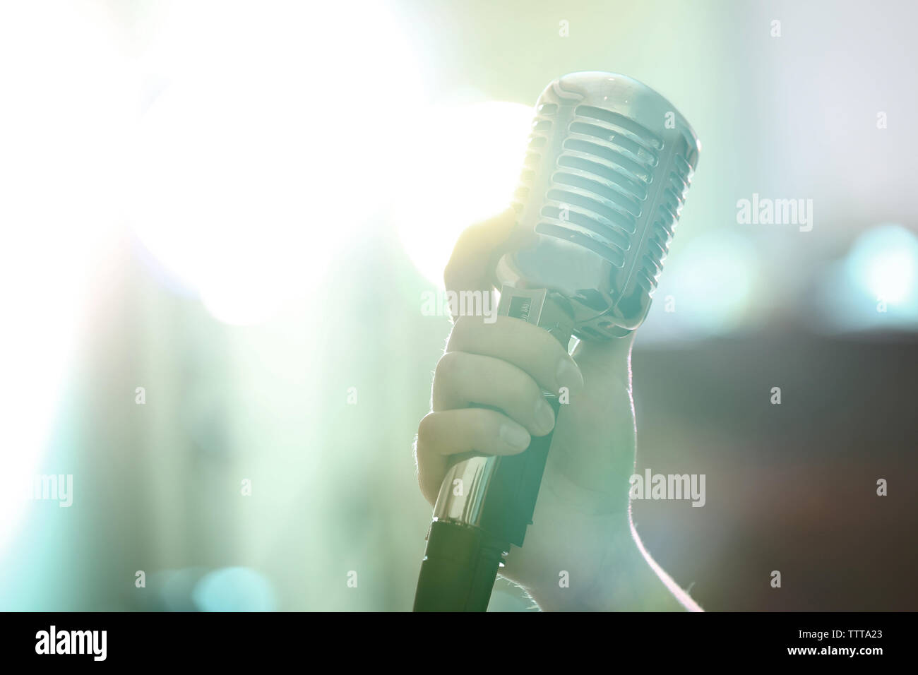 Woman holding microphone closeup hand hi-res stock photography and ...