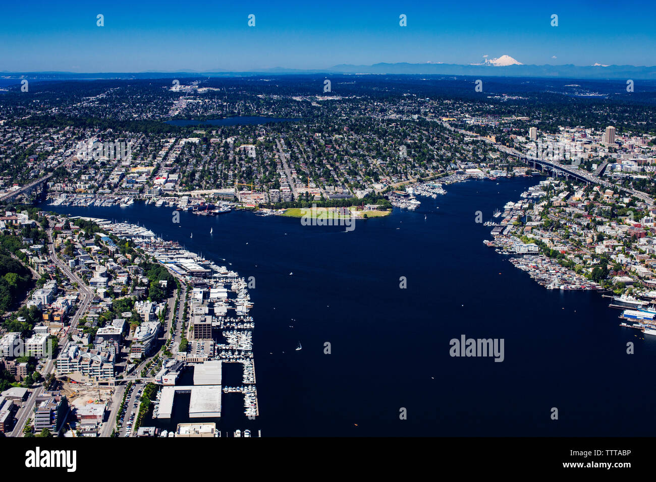 Aerial view of river by city Stock Photo - Alamy