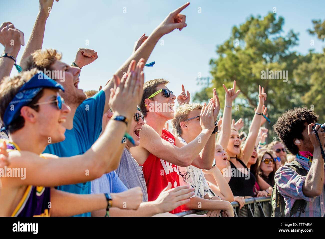Happy Fans Attending The Voodoo Music and Arts Experience Stock Photo ...