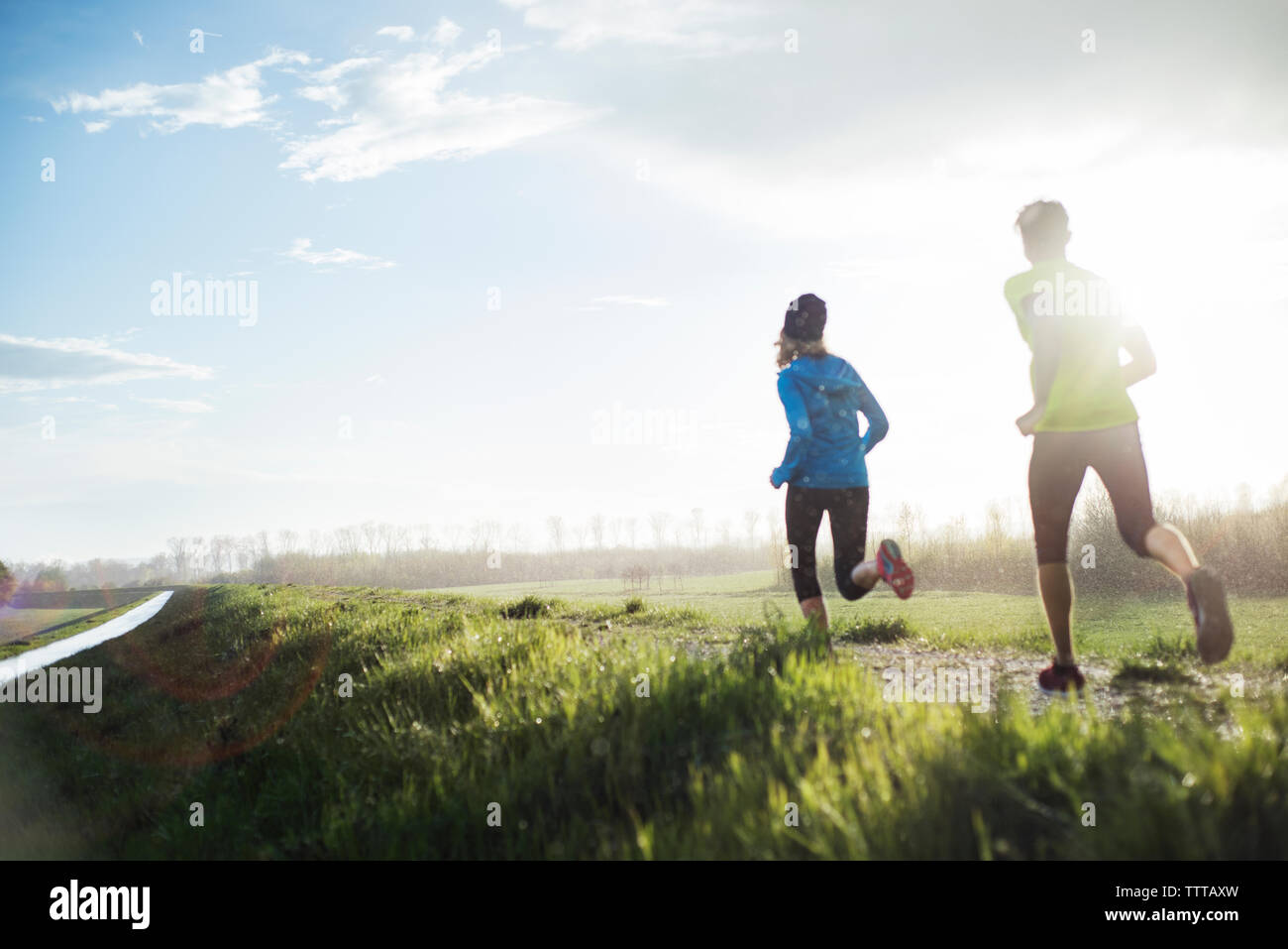 Female running back view full length hi-res stock photography and ...