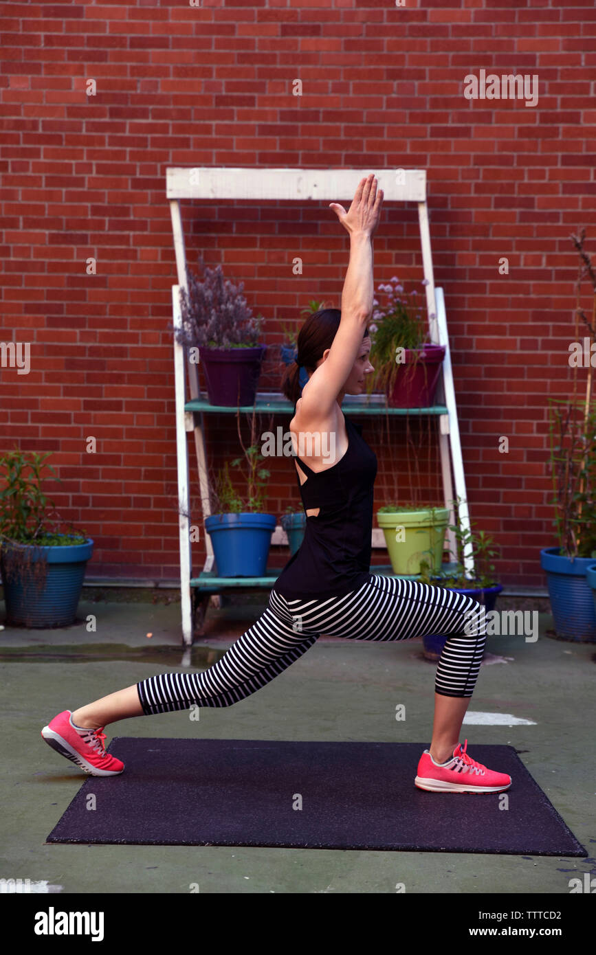 Raised arms pose hi-res stock photography and images - Alamy