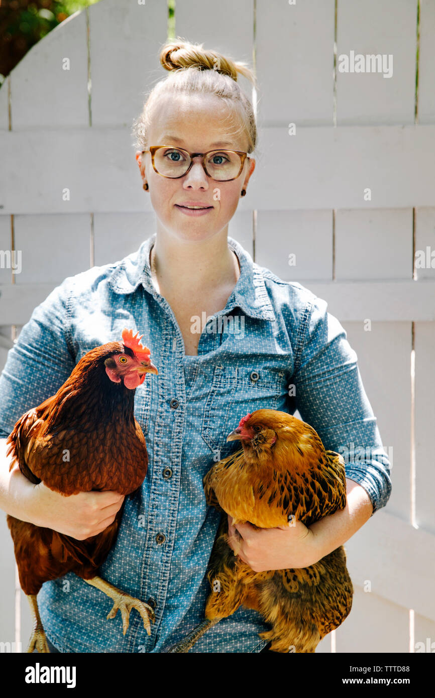 Woman holding rooster hi-res stock photography and images - Alamy