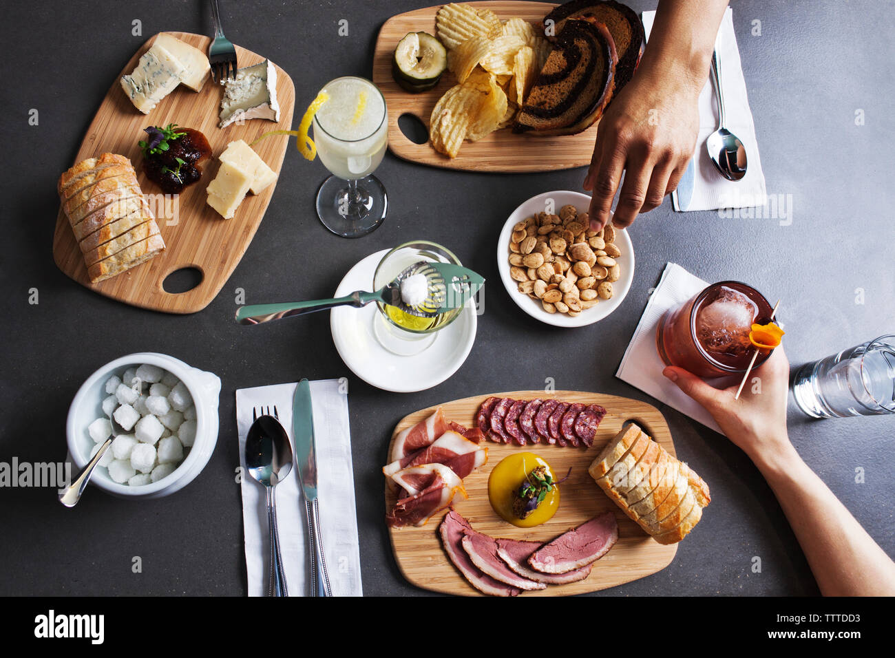 Overhead hands table hi-res stock photography and images - Alamy