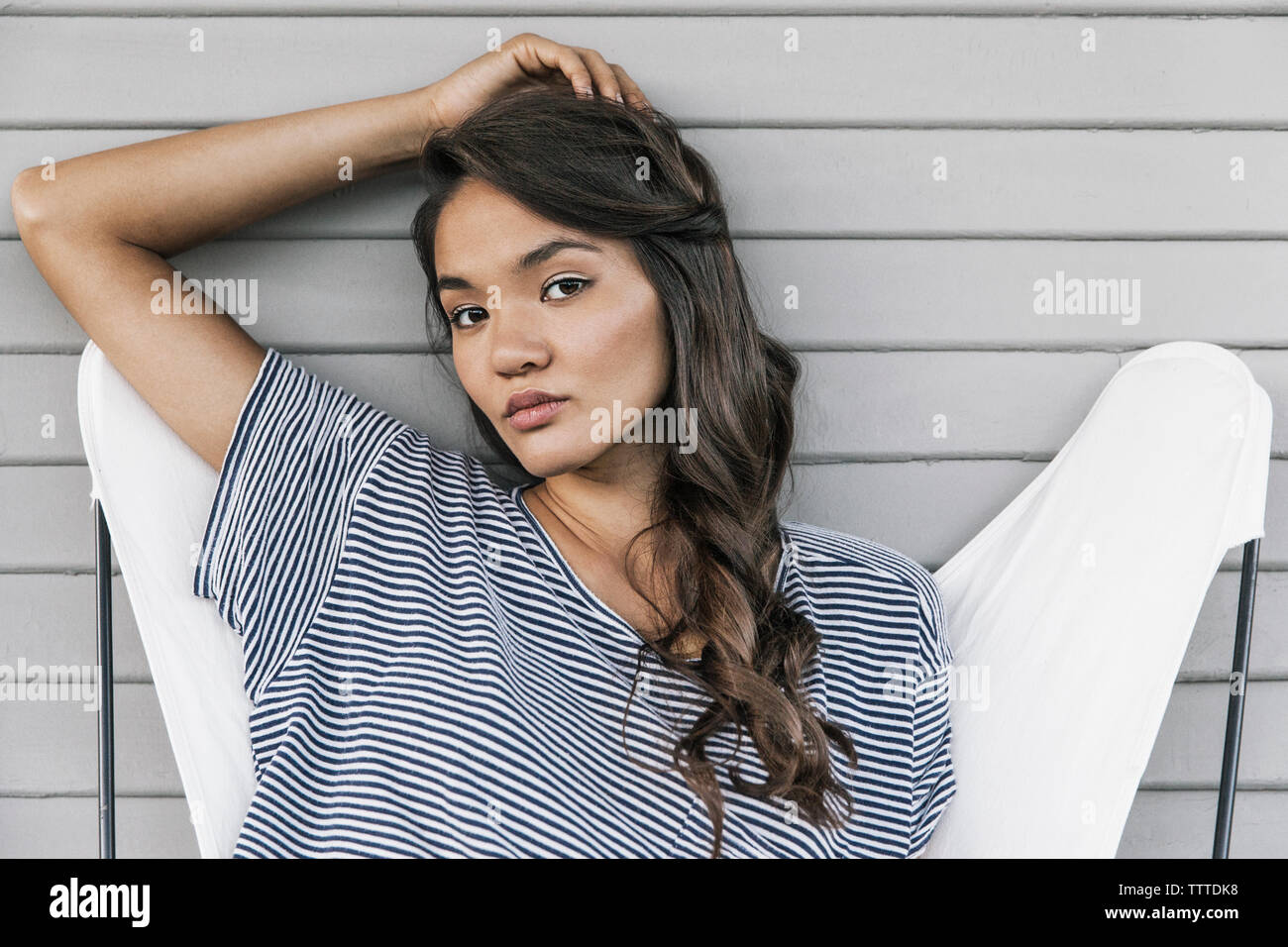 Chair against wall hi-res stock photography and images - Alamy