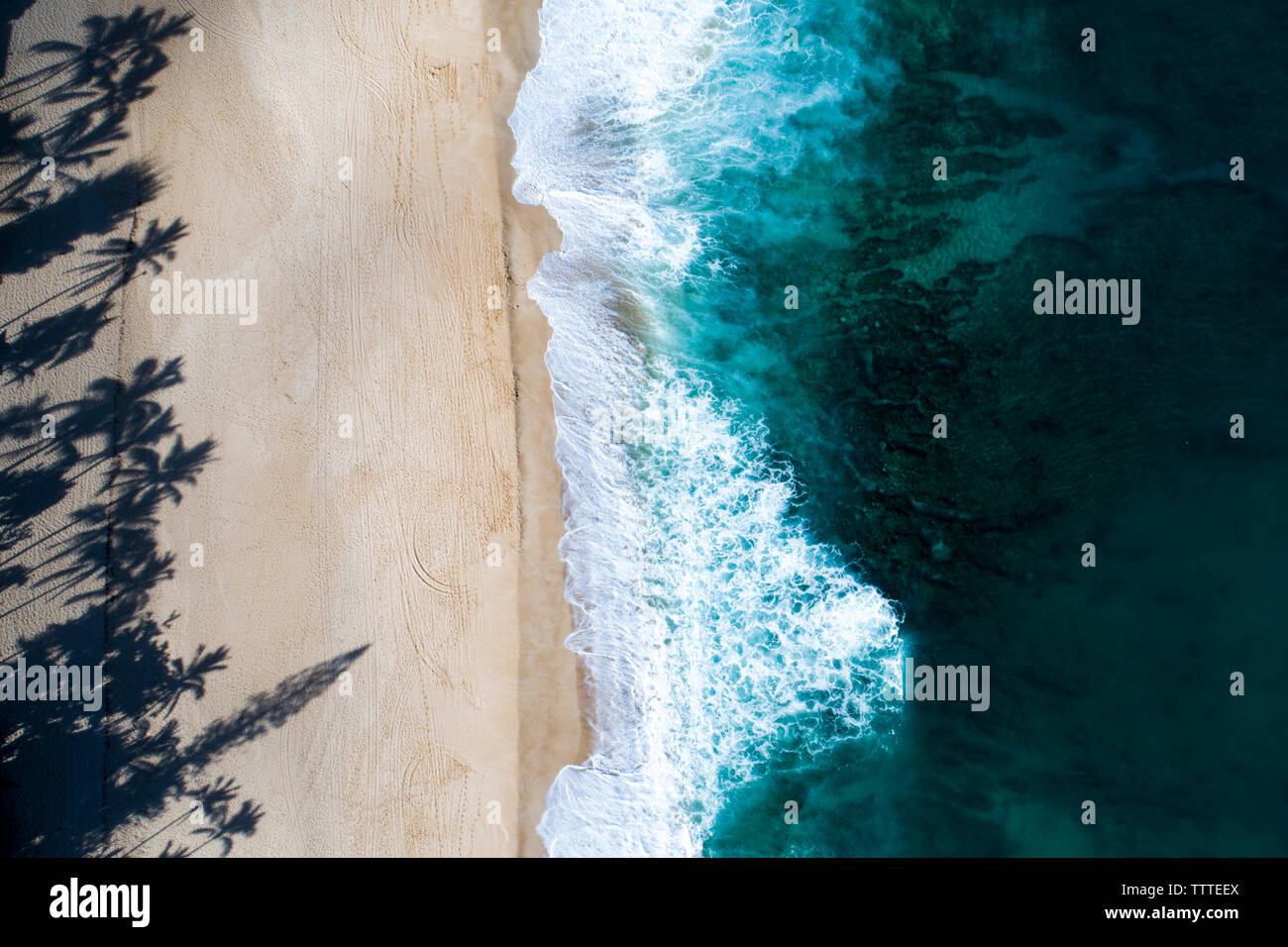 Tilt image of waves on shore at beach Stock Photo - Alamy