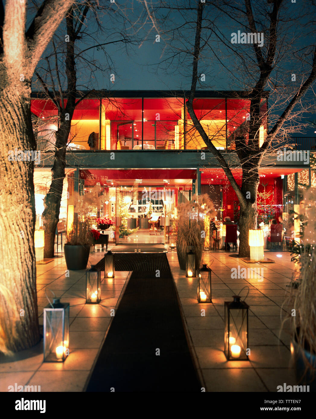 AUSTRIA, Vienna, Stadtpark, illuminated Steirereck Restaurant at dusk ...