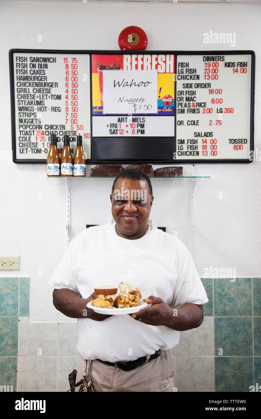 BERMUDA. St. George. Art Mel in his restaurant called Art Me's Spicy ...