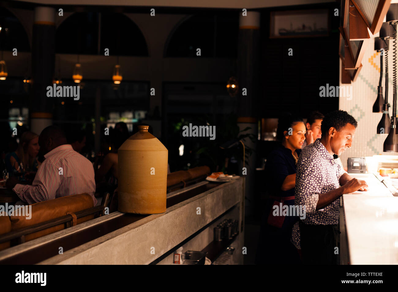 BERMUDA. Hamilton.Kitchen staff and crew during dinner service at ...